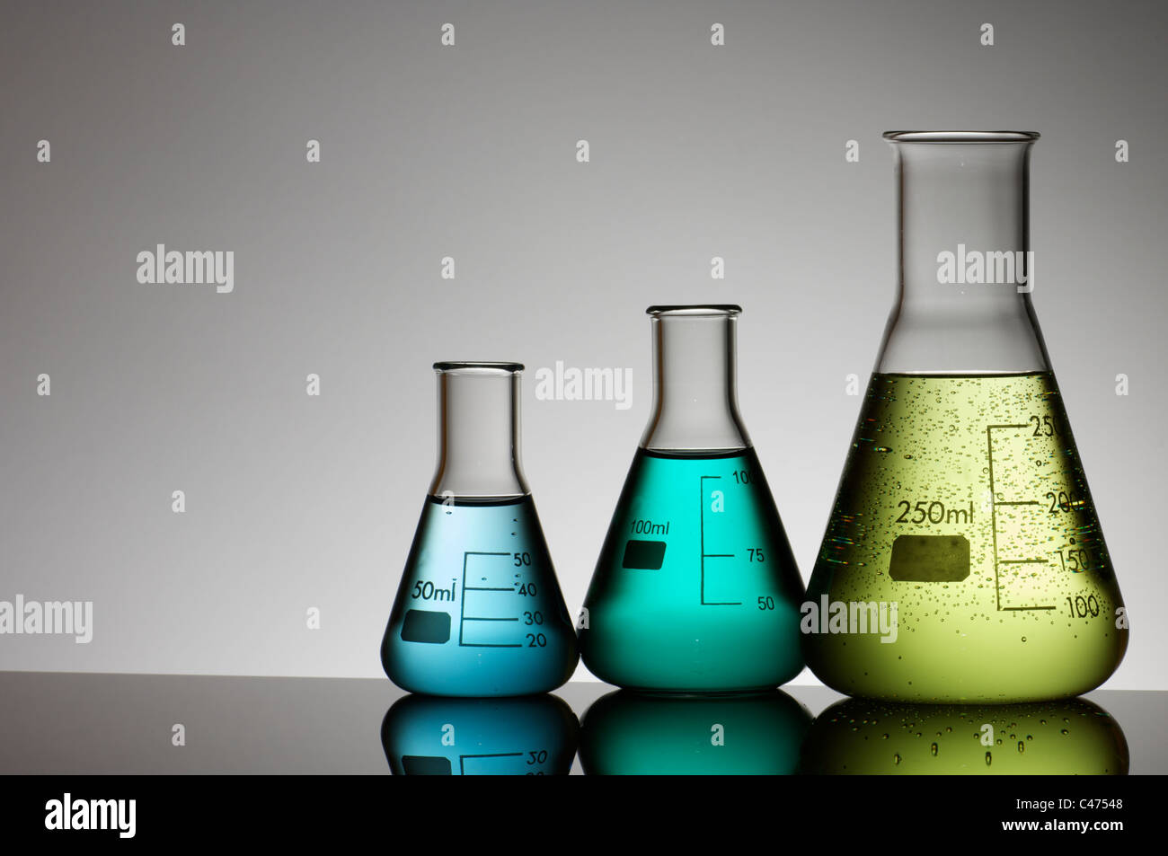 group of three conical flasks containing liquid Stock Photo - Alamy