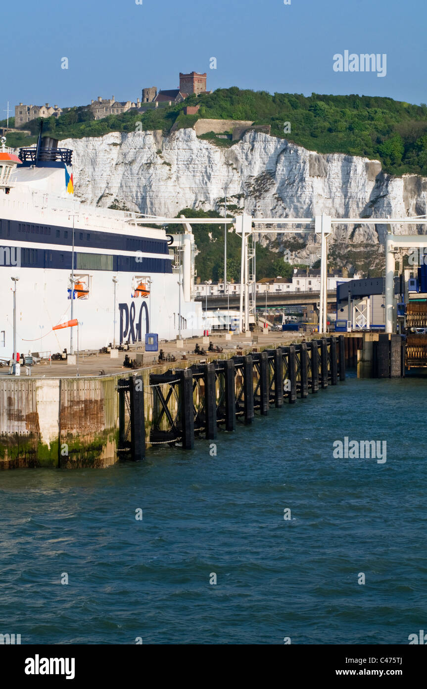 A ferry at the port of Dover in England, with the castle on the white ...