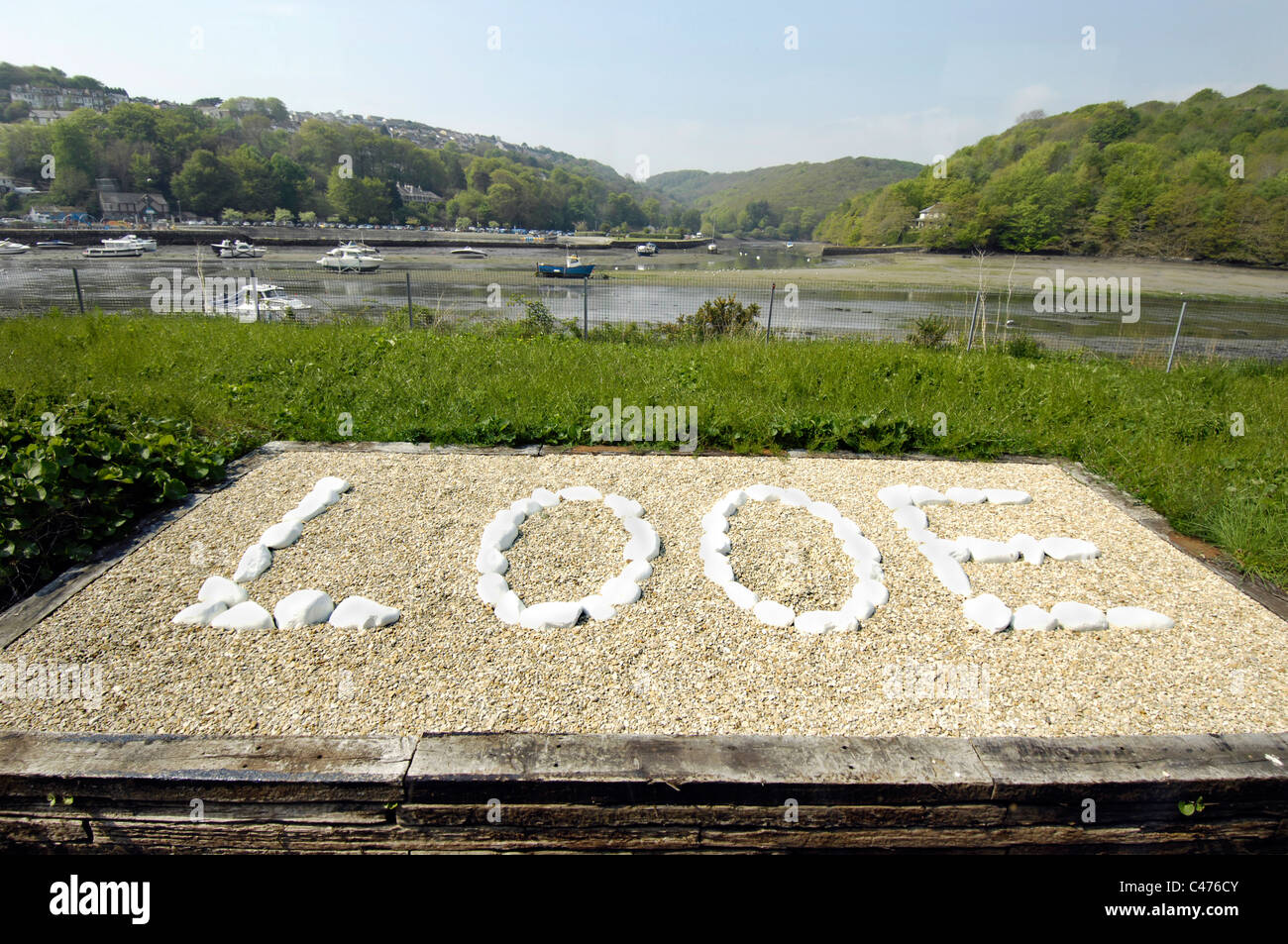 A sign made by railway staff at Looe Railway station from whitewashed ...