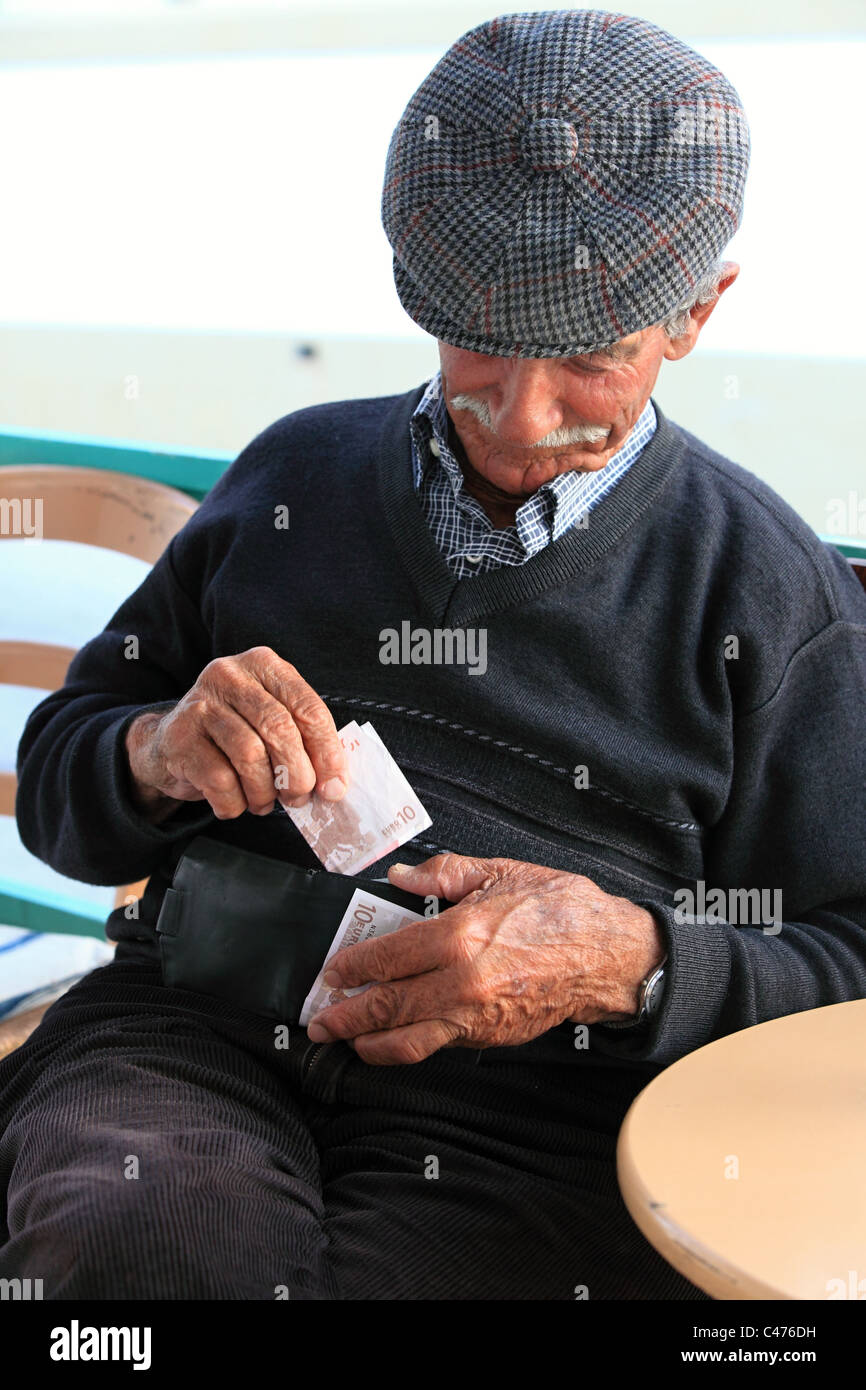 Poor retired men counting money hi-res stock photography and images - Alamy