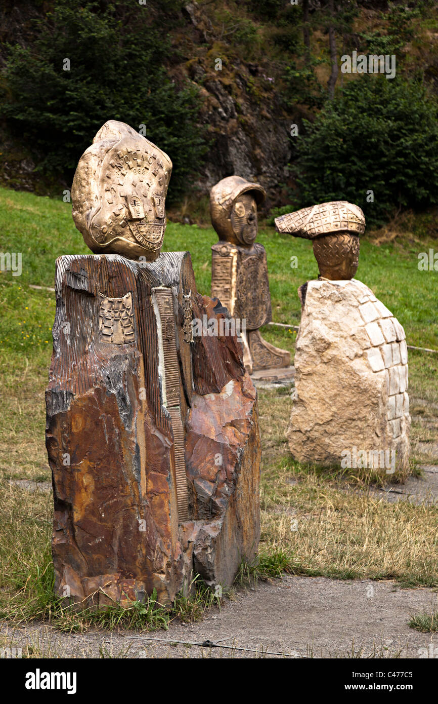 International statues in the Jordino artwork family exhibits in a field ...