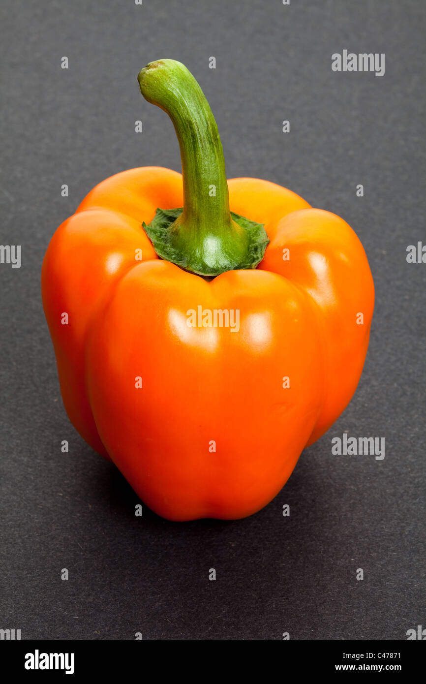 Orange Bell Pepper with black background Stock Photo - Alamy