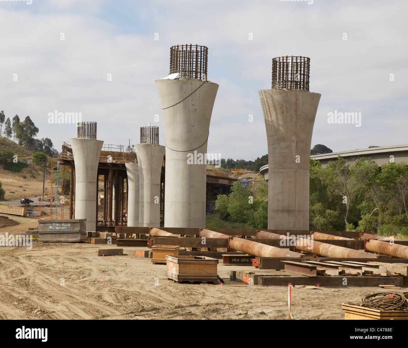 New construction of a highway bridge showing concrete bridge supports ...