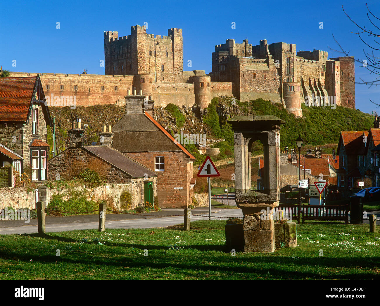 Sunny view of Bamburgh Castle and village, Bamburgh, Northumberland ...