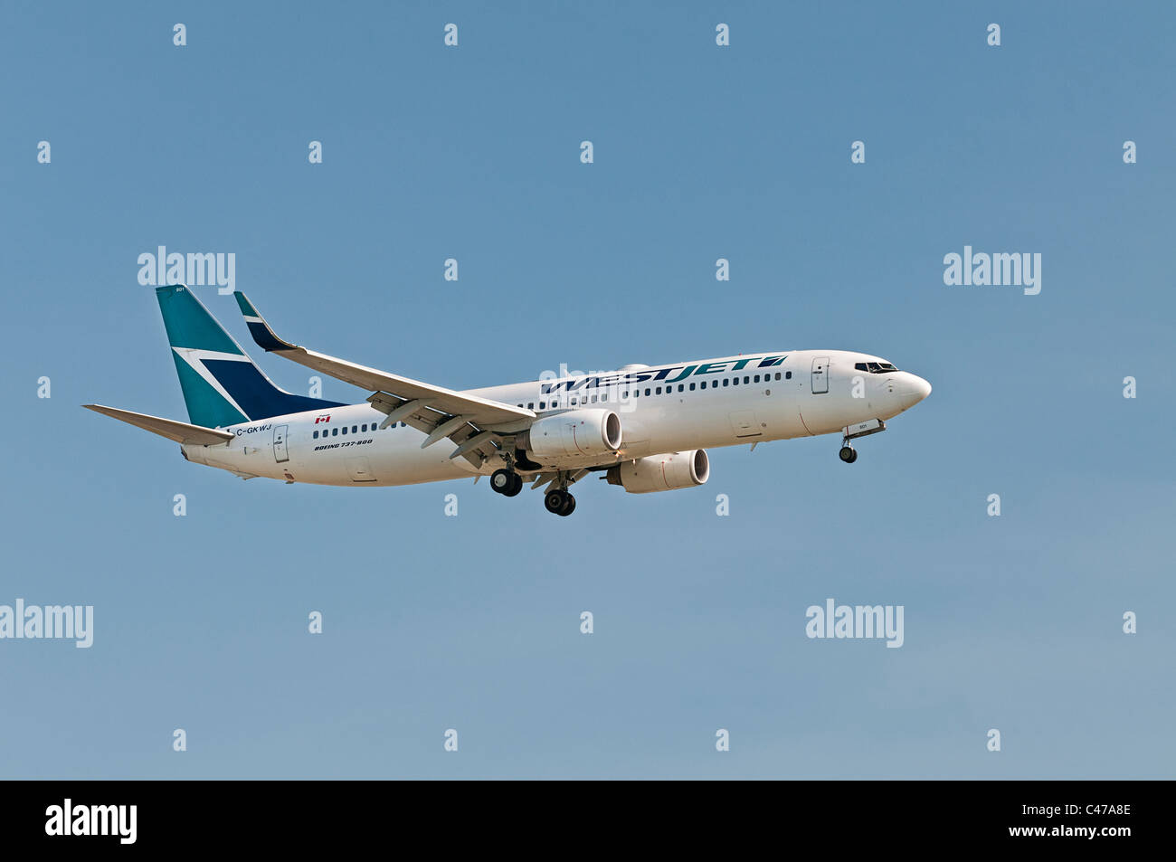 A Westjet Boeing 737-800 jet airliner on final approach for landing ...