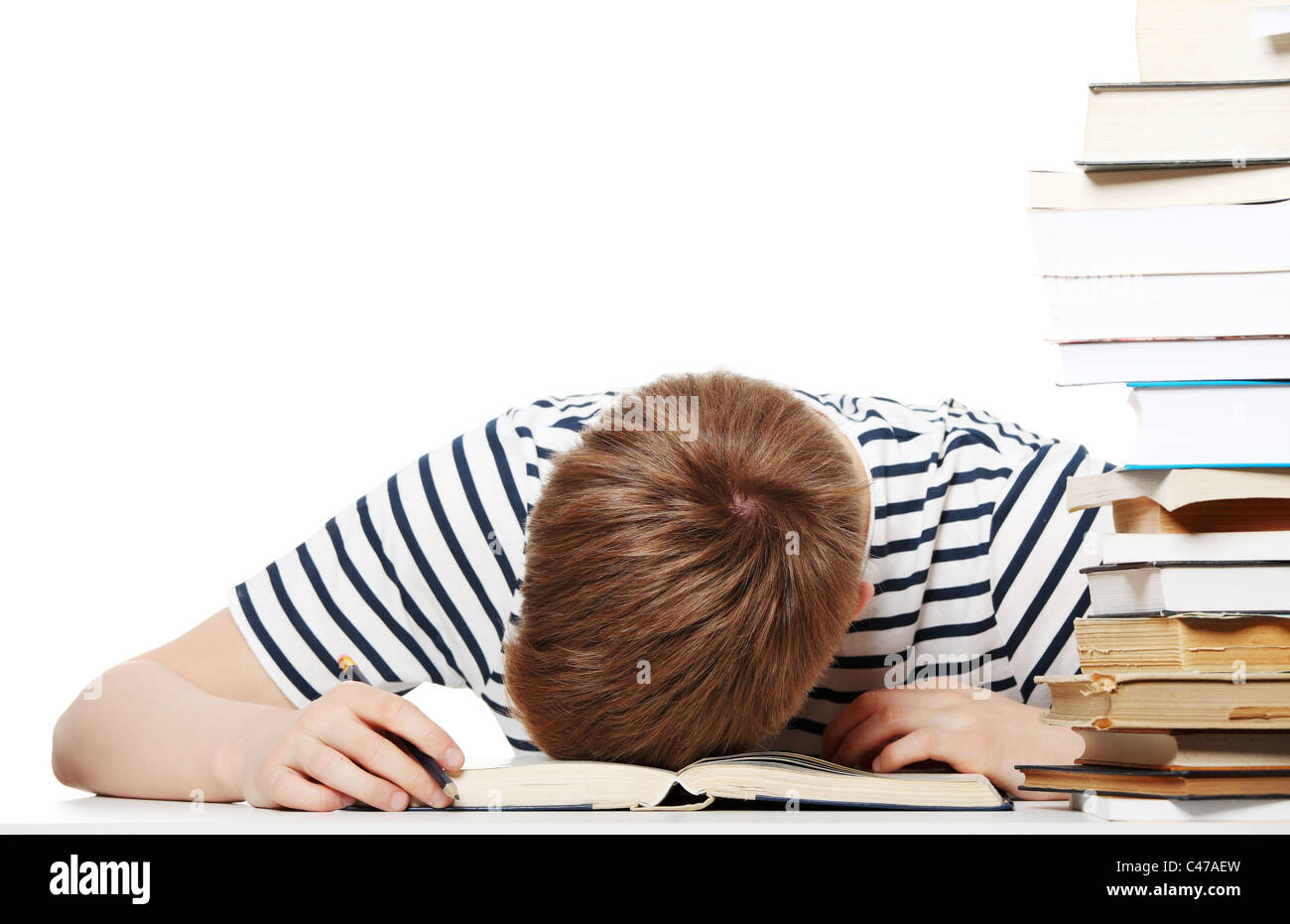 Tired student at the desk, isolated on white Stock Photo - Alamy