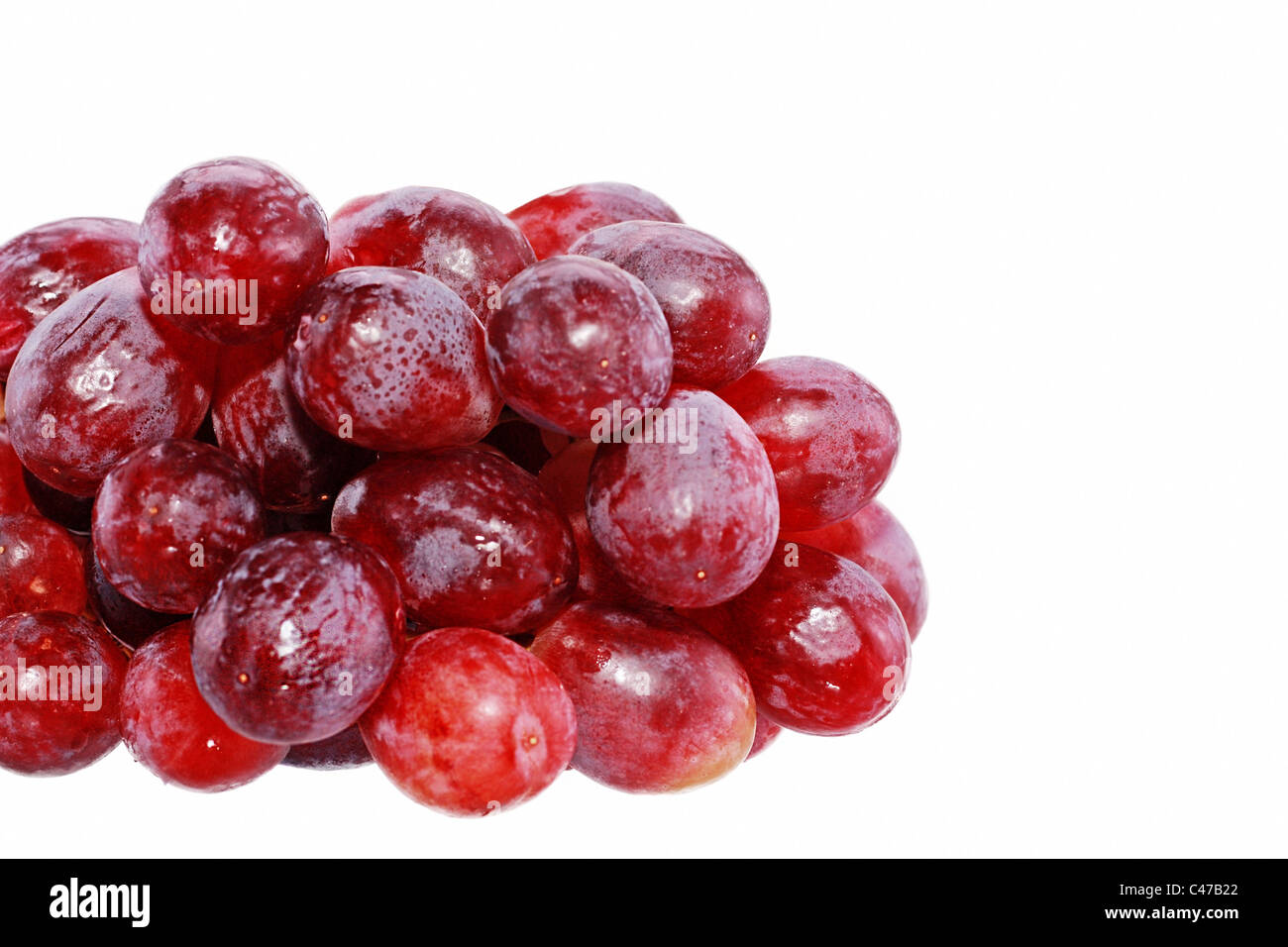 Red grapes isolated on white background Stock Photo - Alamy