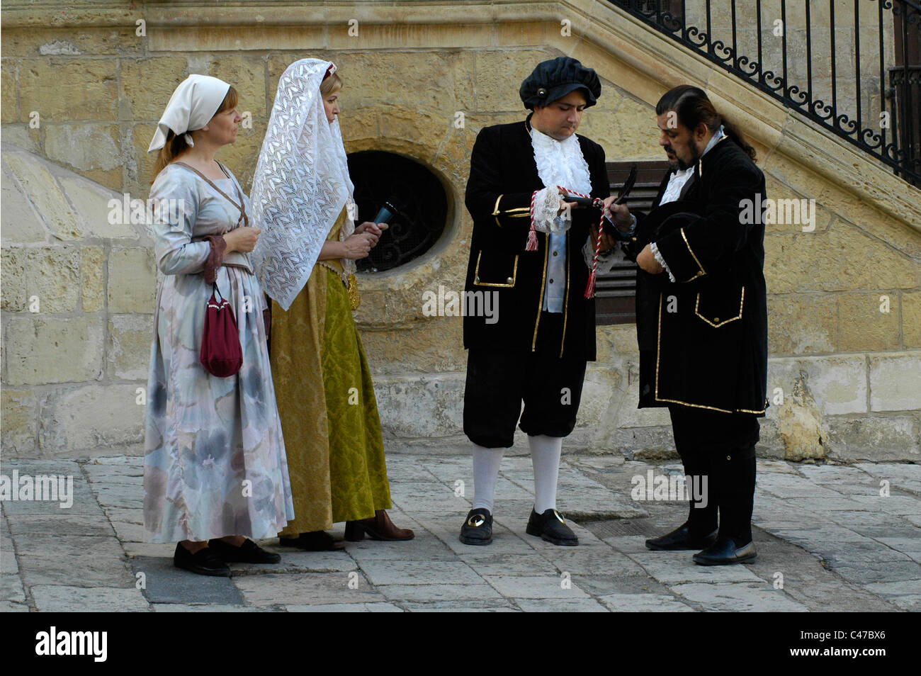 Locals dressed in medieval garment during historical re-enactment ...