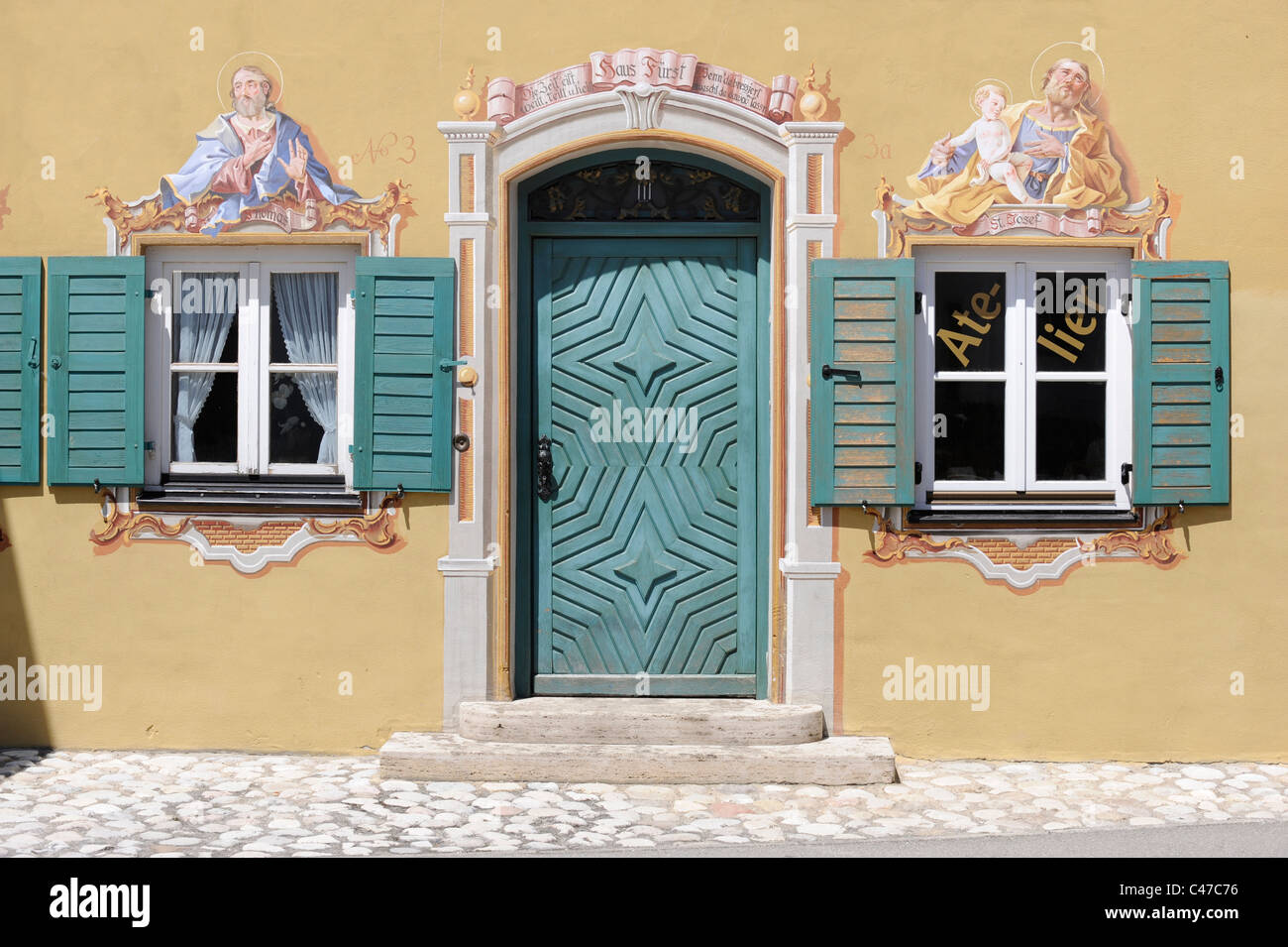 house facade and window decorated with traditional painting in Bavaria ...
