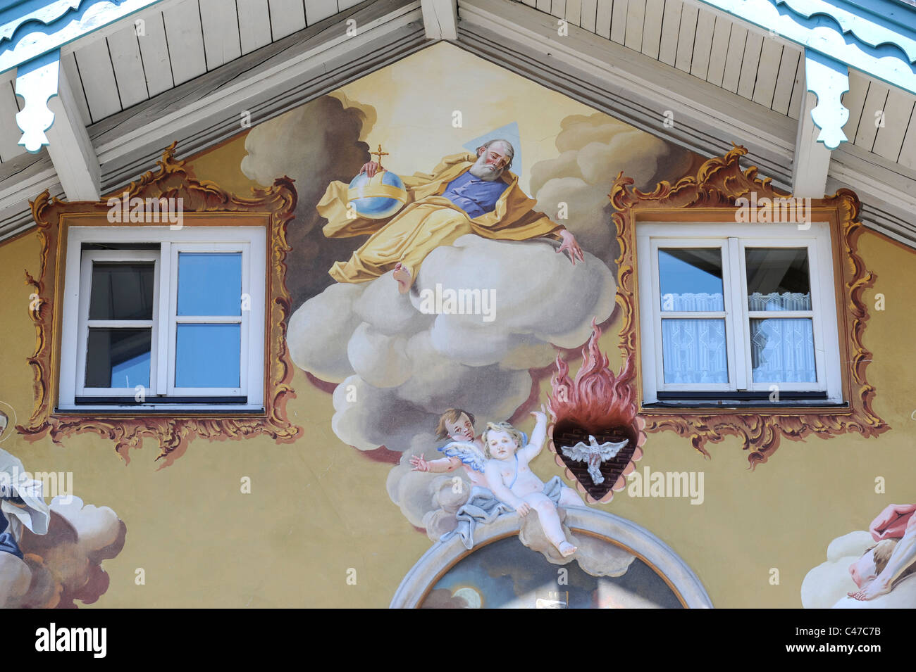 house facade and window decorated with traditional painting in Bavaria ...