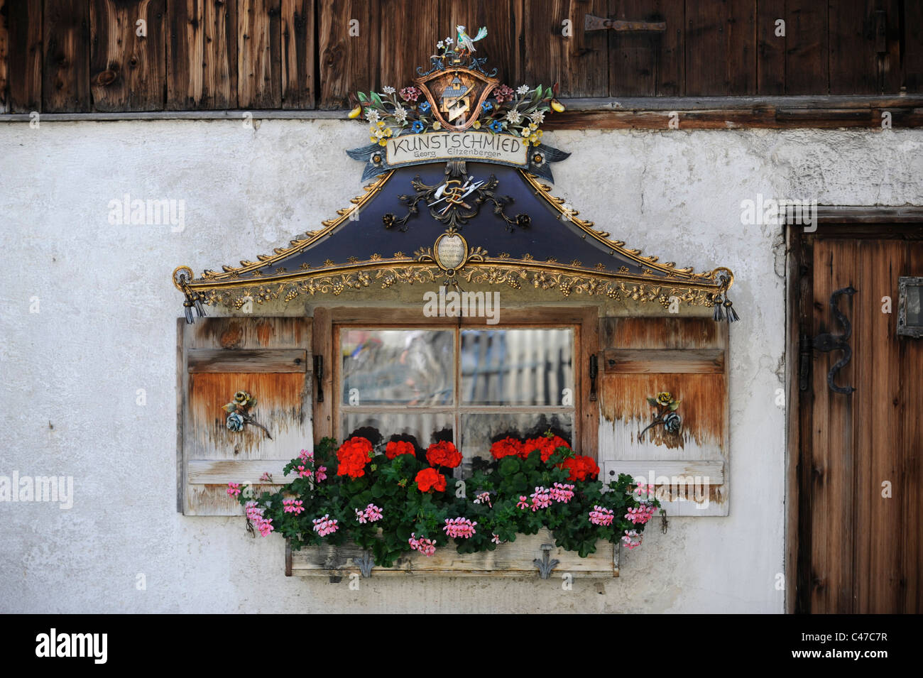 house facade and window decorated with traditional painting in Bavaria ...