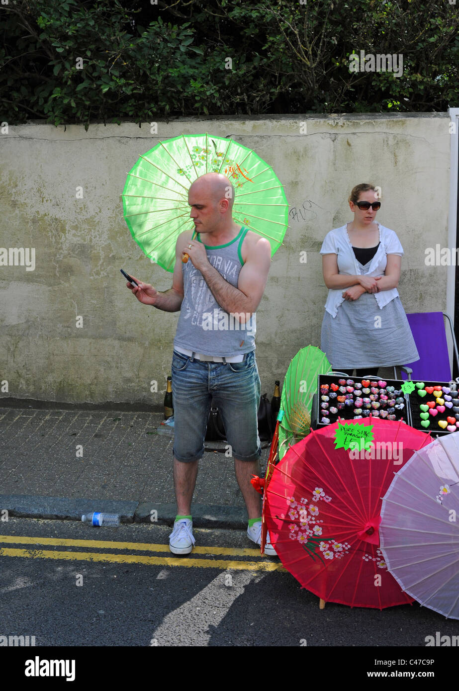 Man holding parasol hi-res stock photography and images - Alamy