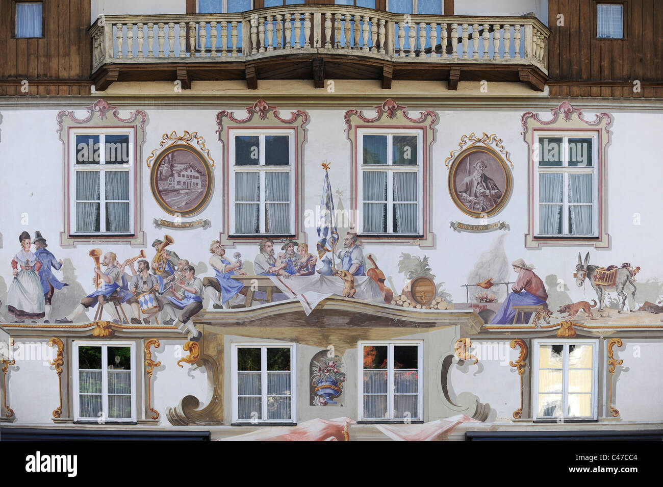 house facade and window decorated with traditional painting in Bavaria ...