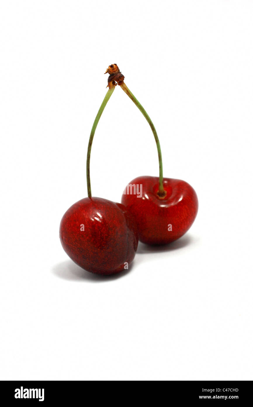 Red cherries on white background Cut Out Stock Images & Pictures - Alamy