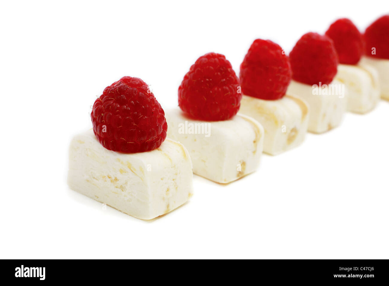 candy from nougat with caramel and raspberry Stock Photo - Alamy