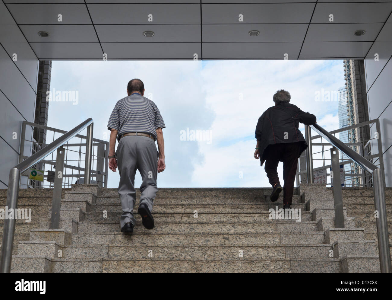 Elderly walking up steps hi-res stock photography and images - Alamy