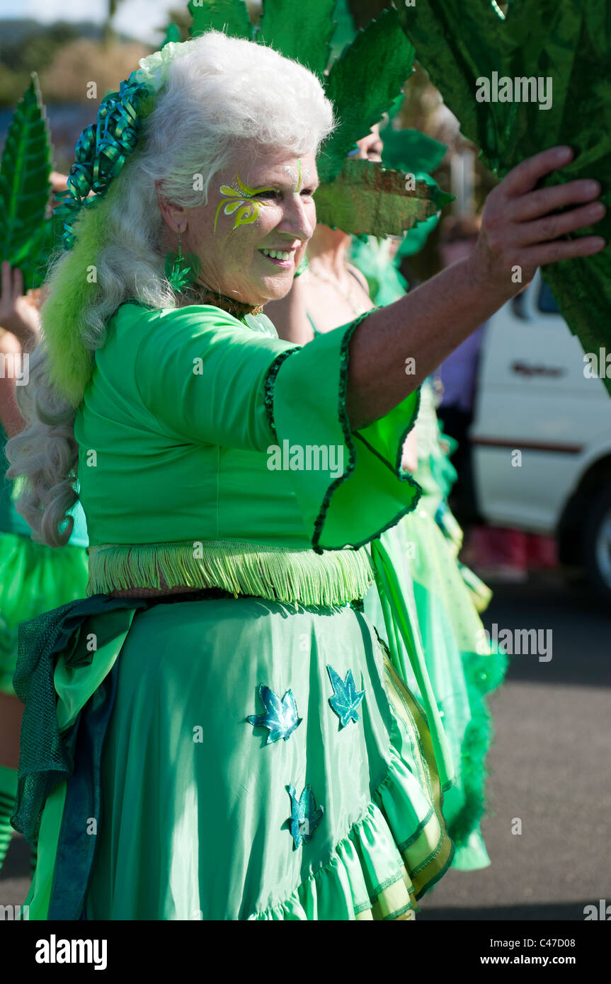 Mature woman takes part in Nimbin's Mardi Grass parade which protests ...