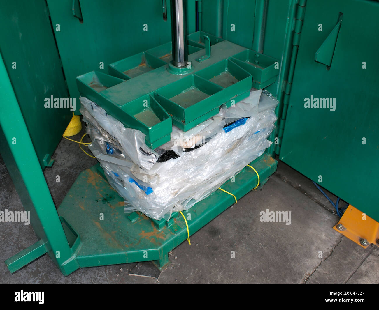 Polythene compacting machine Stock Photo - Alamy