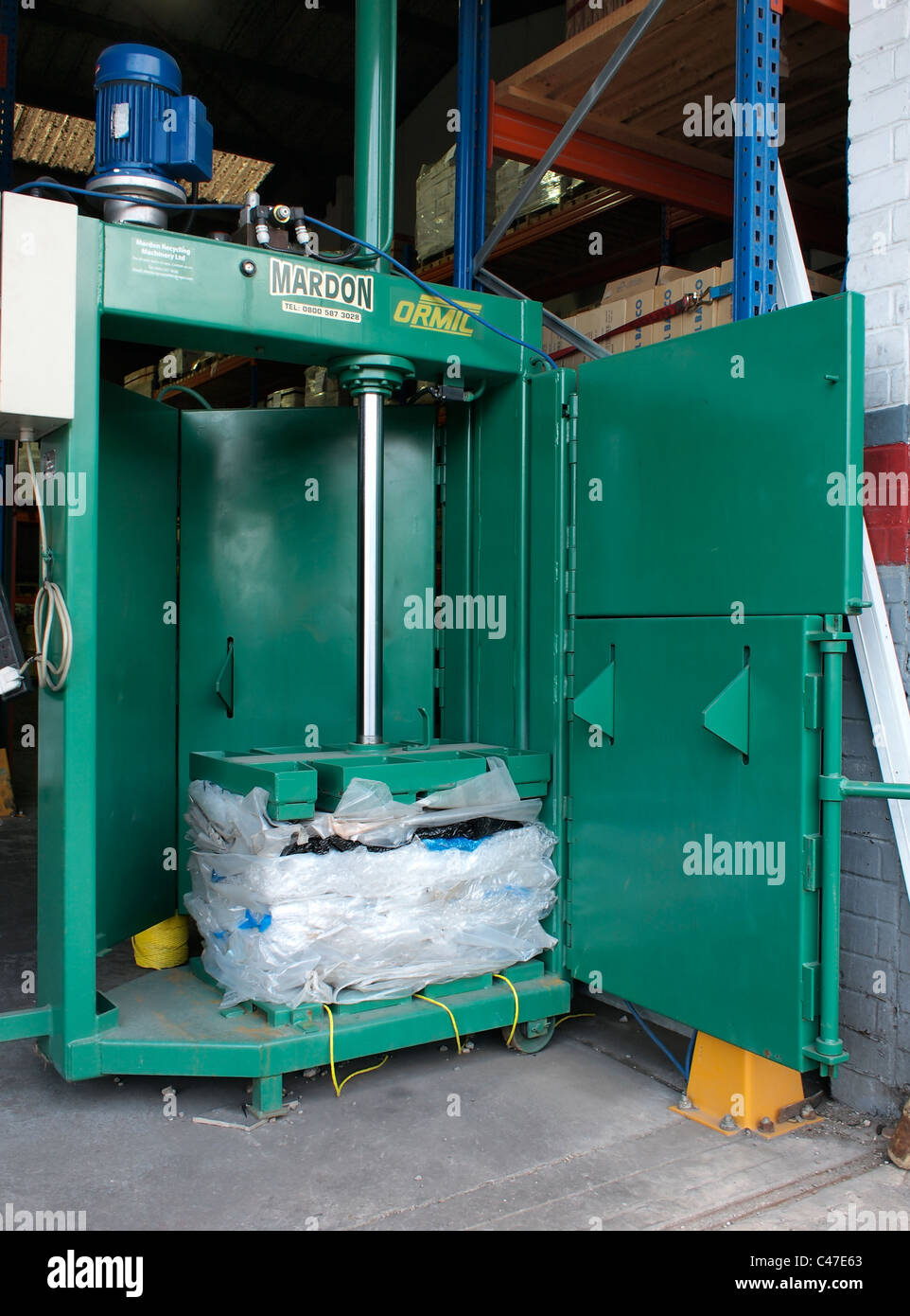 Polythene compacting machine Stock Photo - Alamy