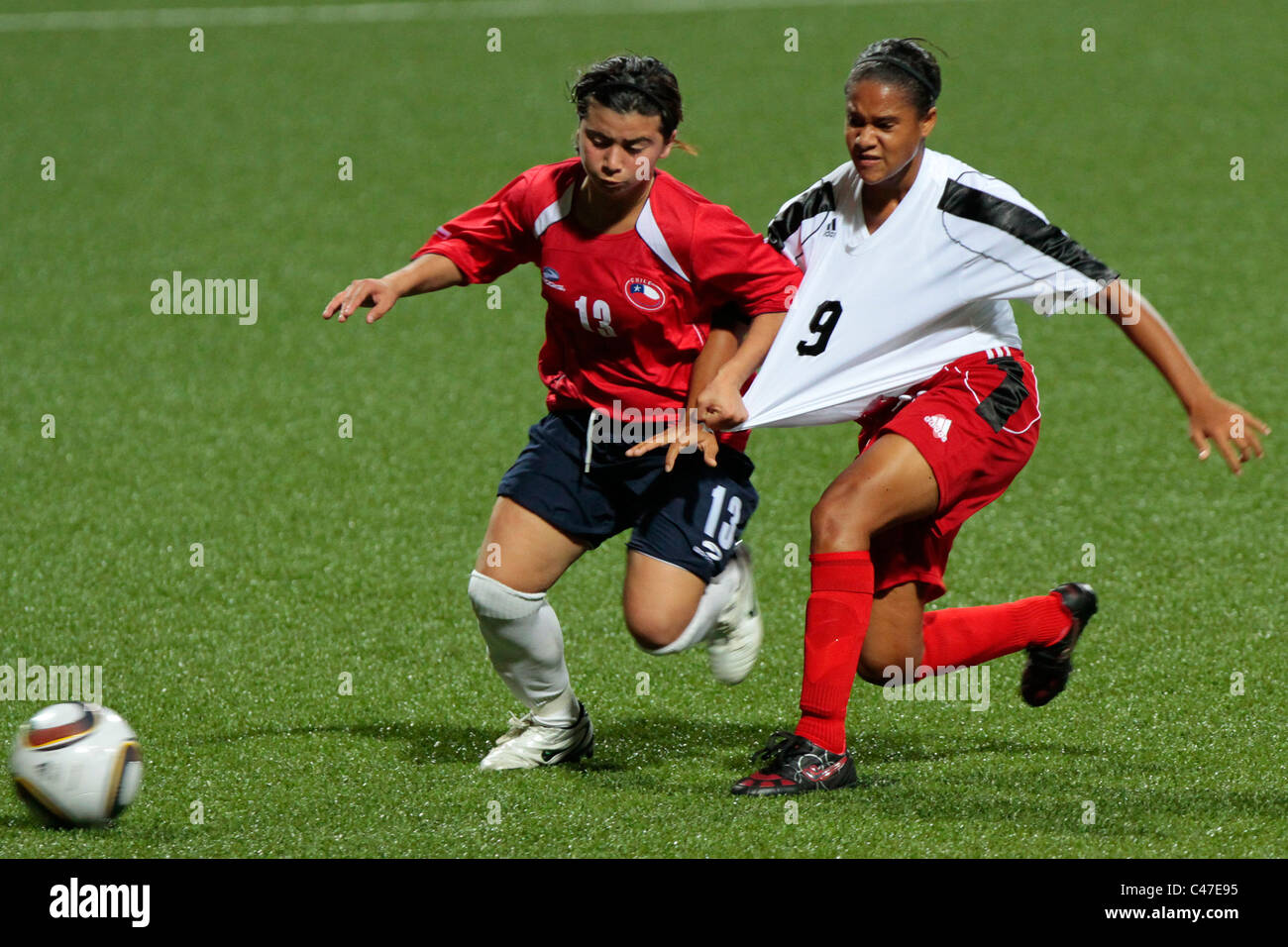 Trinidad & Tobago's Shanisa Camejo(whte) and Chile's Katherine ...