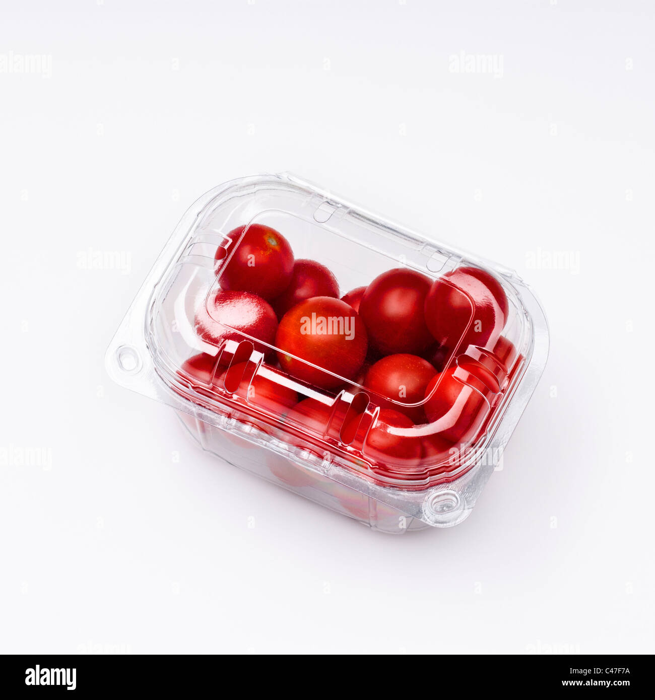 Cherry tomatoes in clear plastic box Stock Photo - Alamy