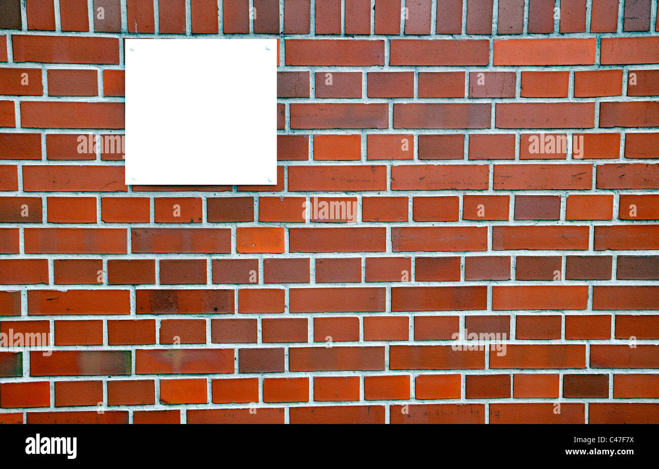 Empty board on the wall of red bricks Stock Photo - Alamy