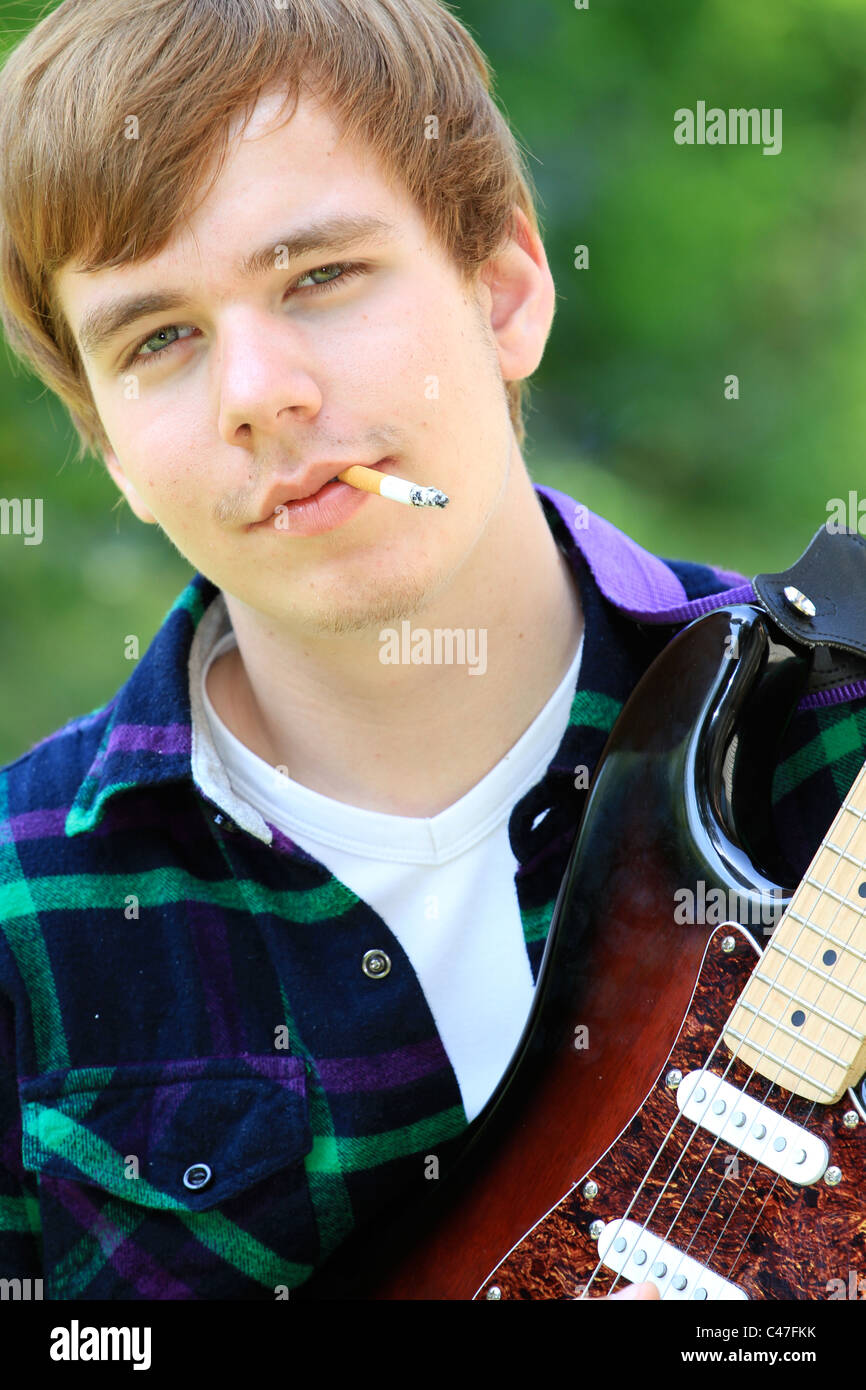 Playing guitar while smoking hi-res stock photography and images - Alamy