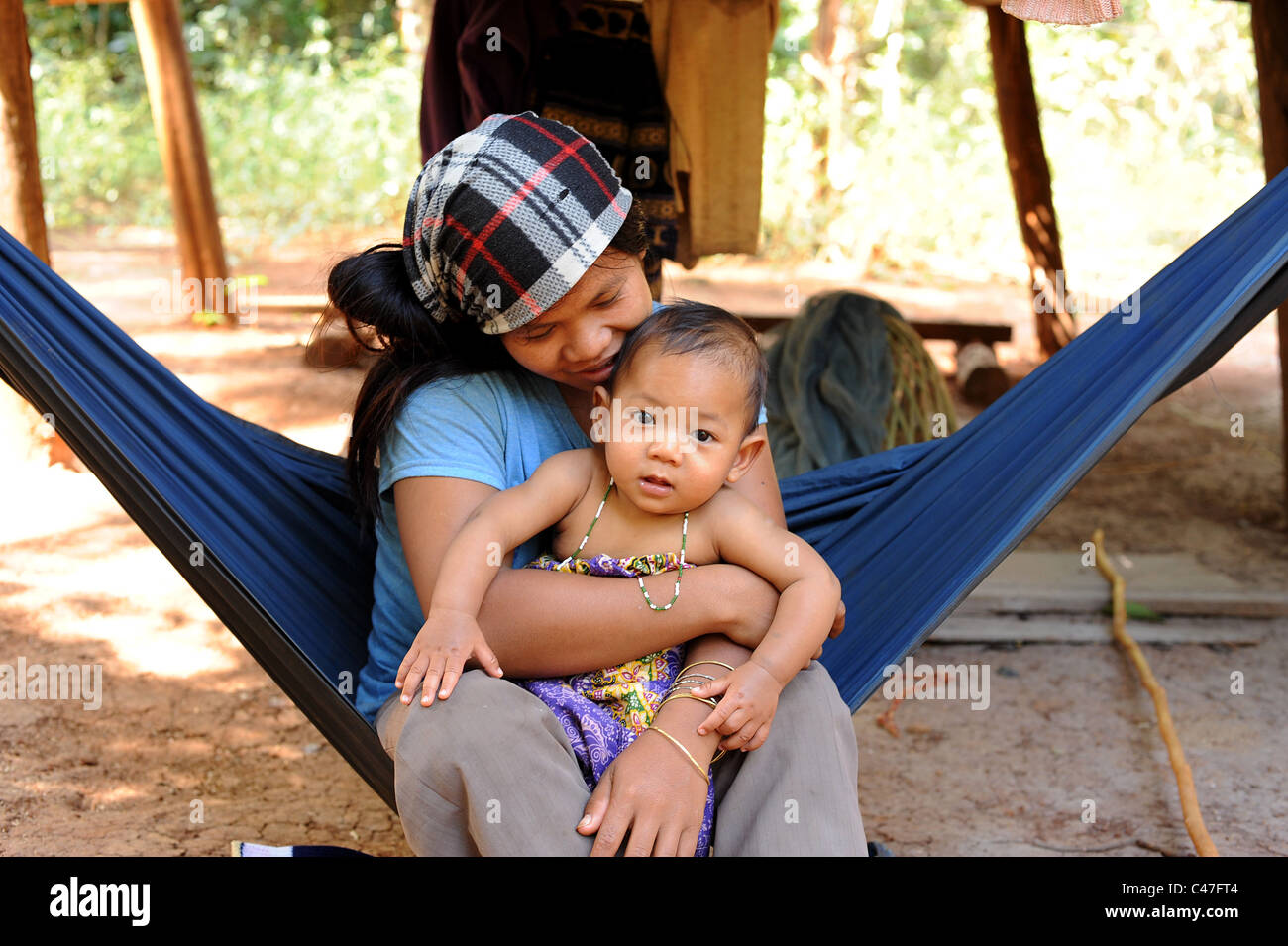 Happy dad carries serious podgy cute son Stock Photo - Alamy