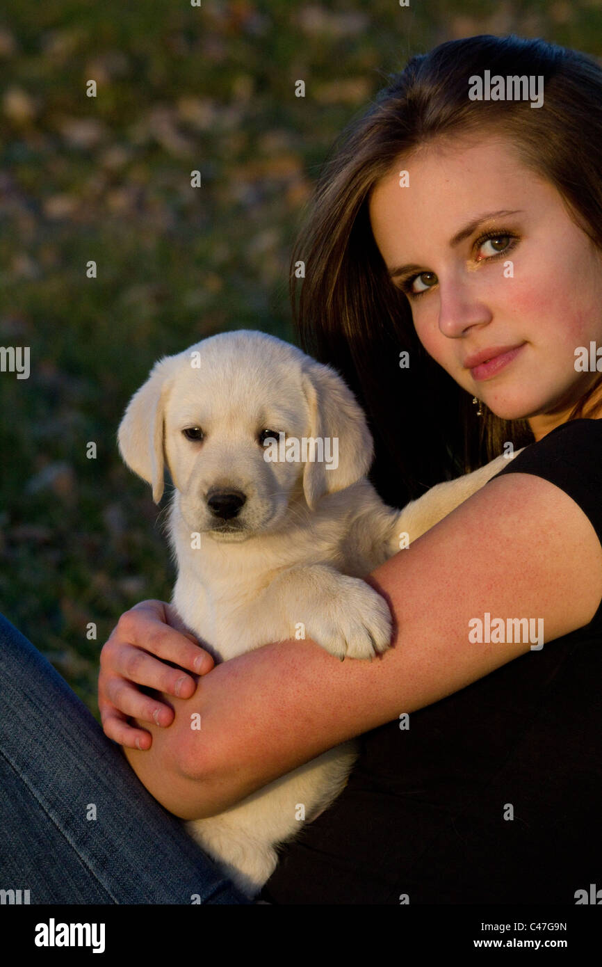 Young woman and Labrador retriever Stock Photo - Alamy