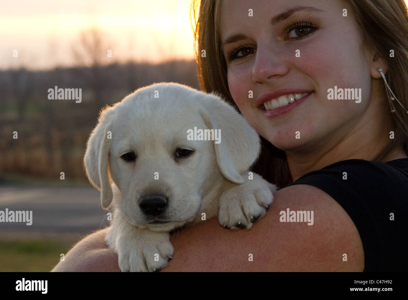 Young woman and Labrador retriever Stock Photo - Alamy