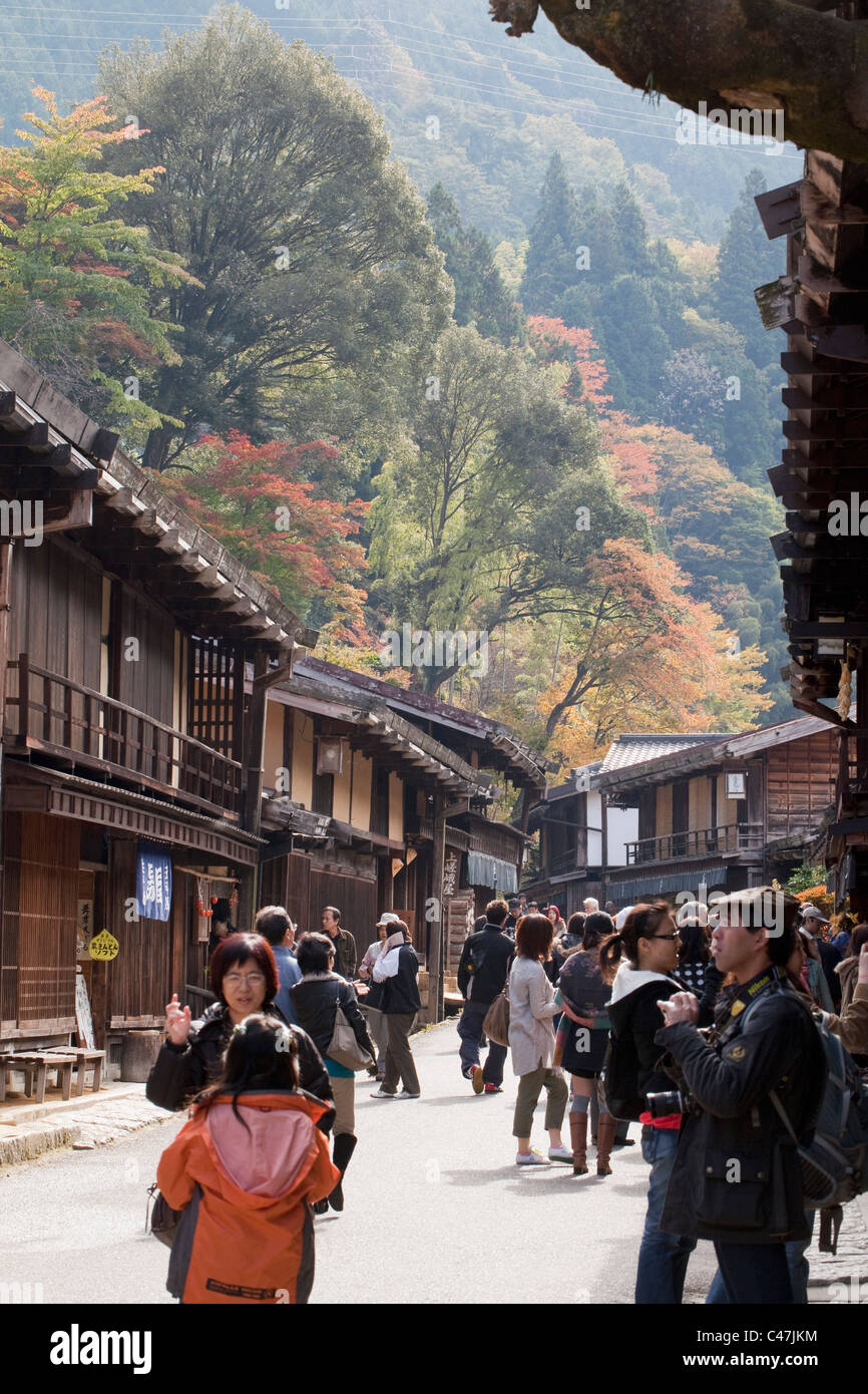 Visitors exploring shops and seeing sights along Nakasendo post road ...