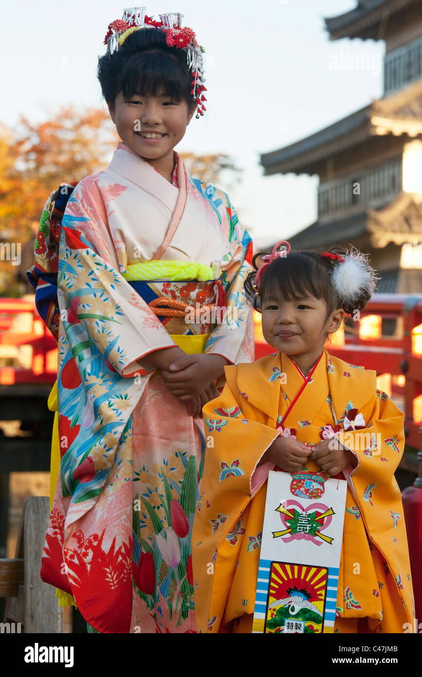 Children in kimono posing in front of Matsumoto Castle during Shichi-Go ...