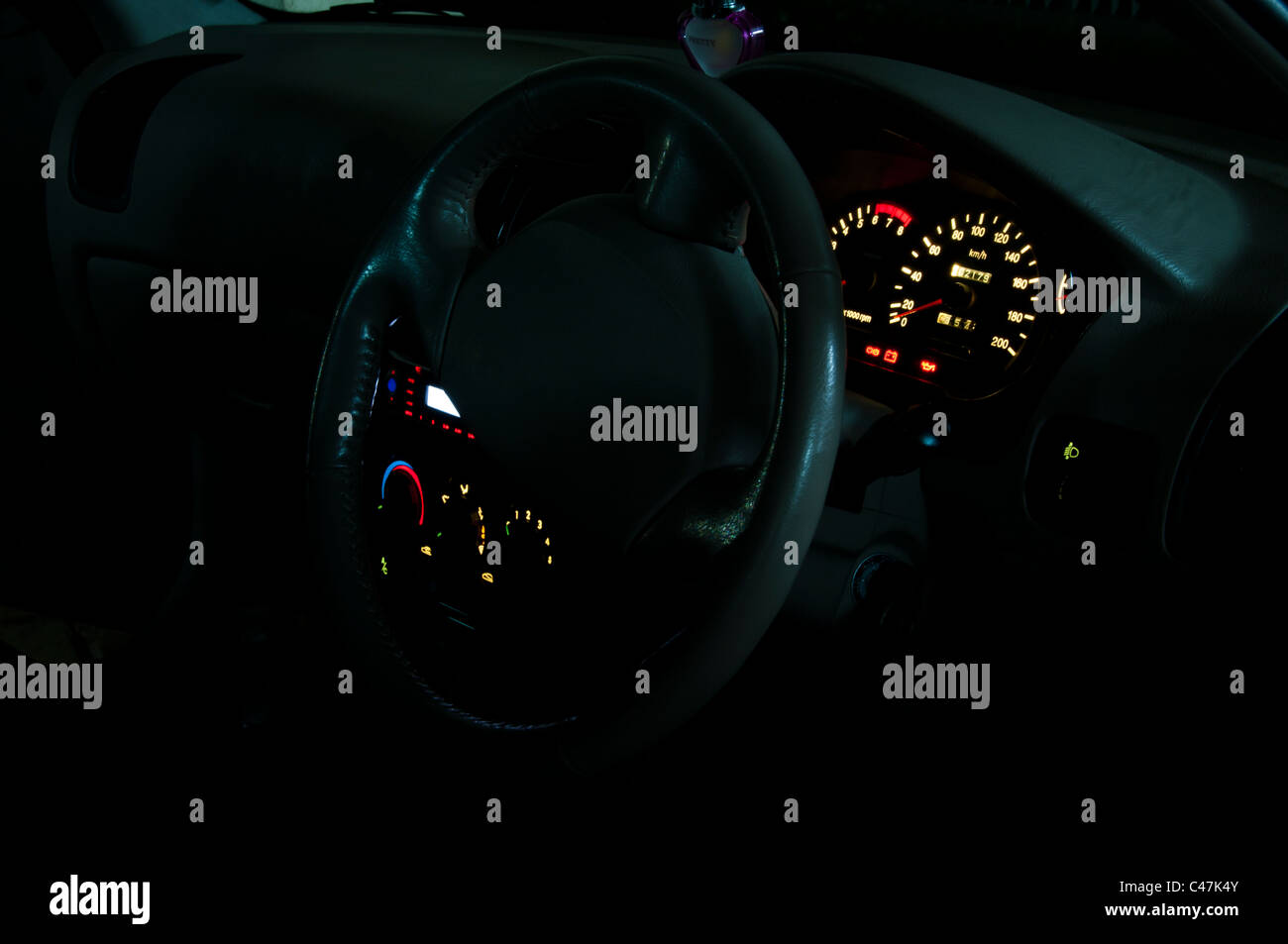 Car interior at night with illuminated speedometer Stock Photo - Alamy