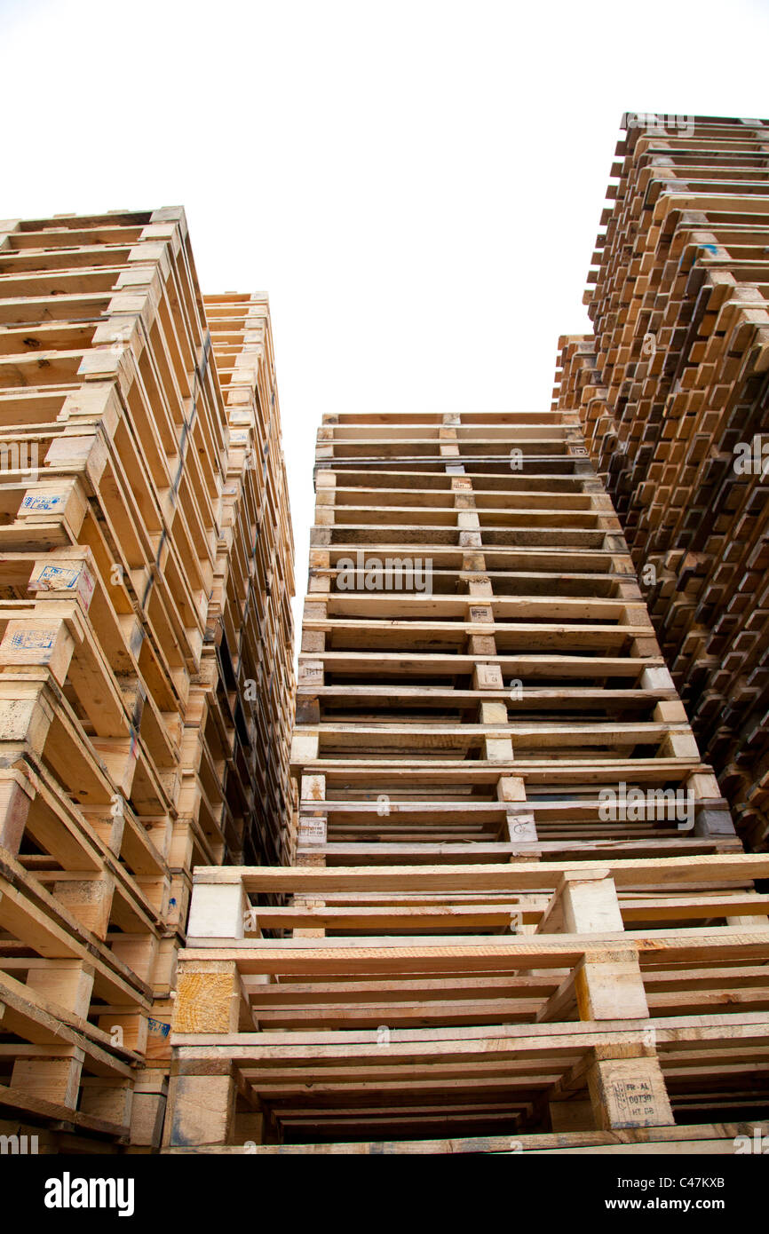 Pile of pallets isolated on white Stock Photo - Alamy