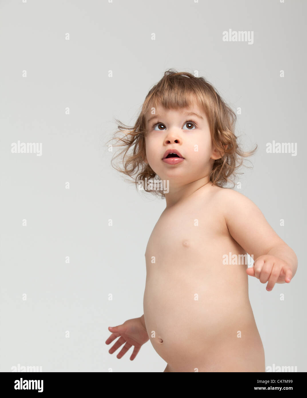 little preescolar looking up surprised blank space Stock Photo - Alamy