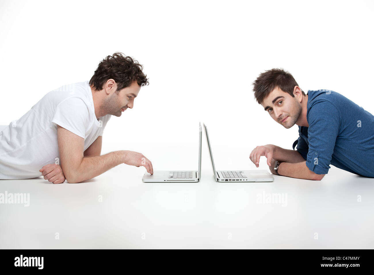 young handsome men looking at laptop Stock Photo - Alamy