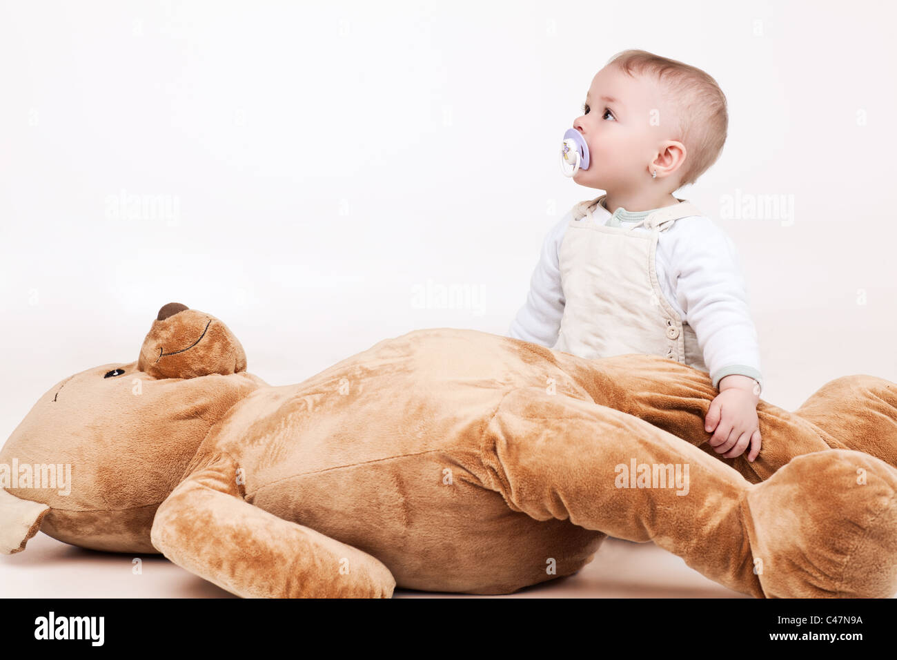baby girl with bear smiling happy hands Stock Photo - Alamy