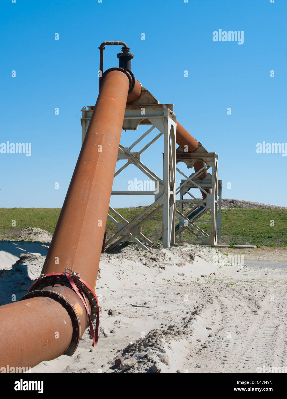pipeline for oil transport guided over a road Stock Photo - Alamy