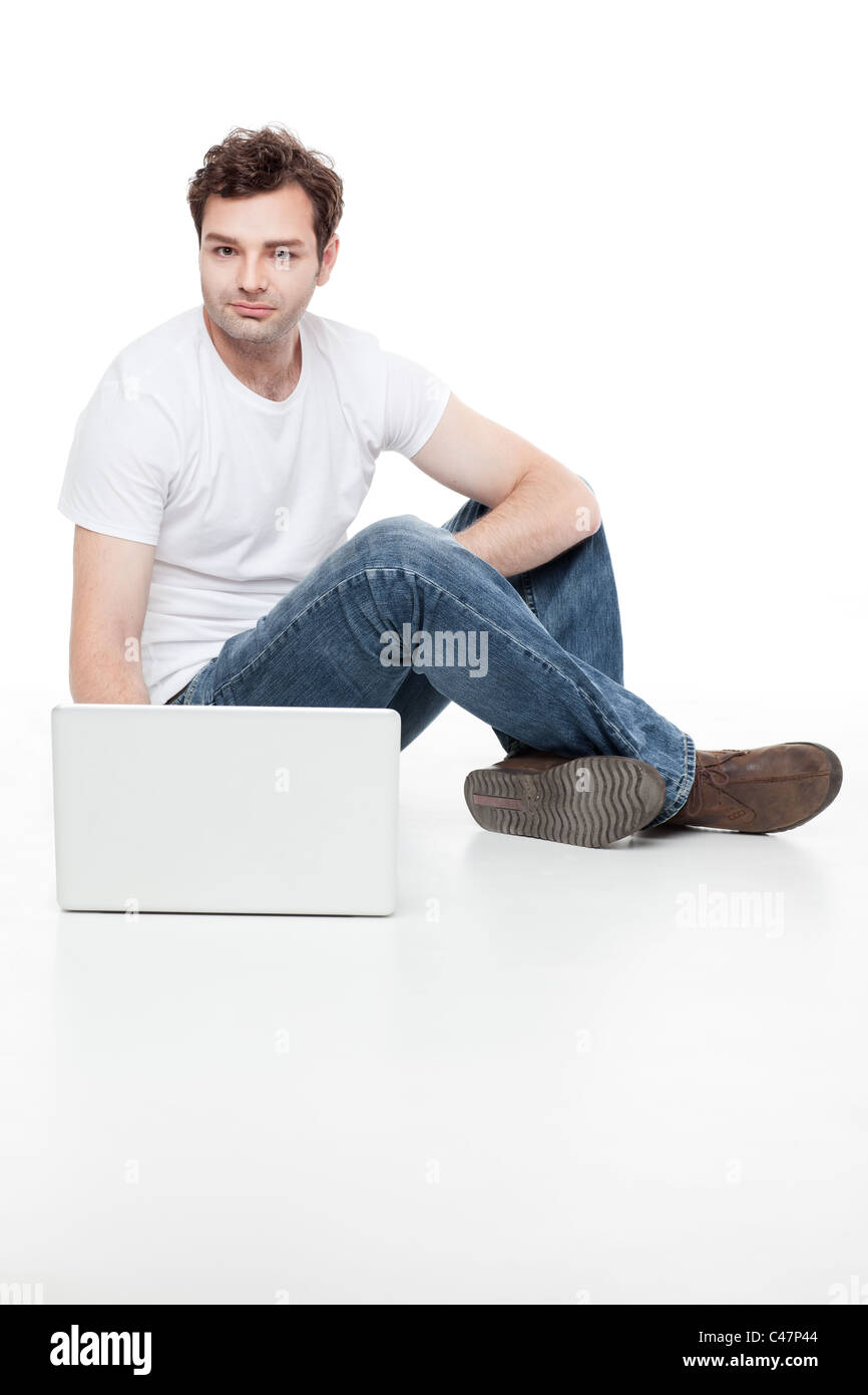man sitting behind laptop Stock Photo - Alamy