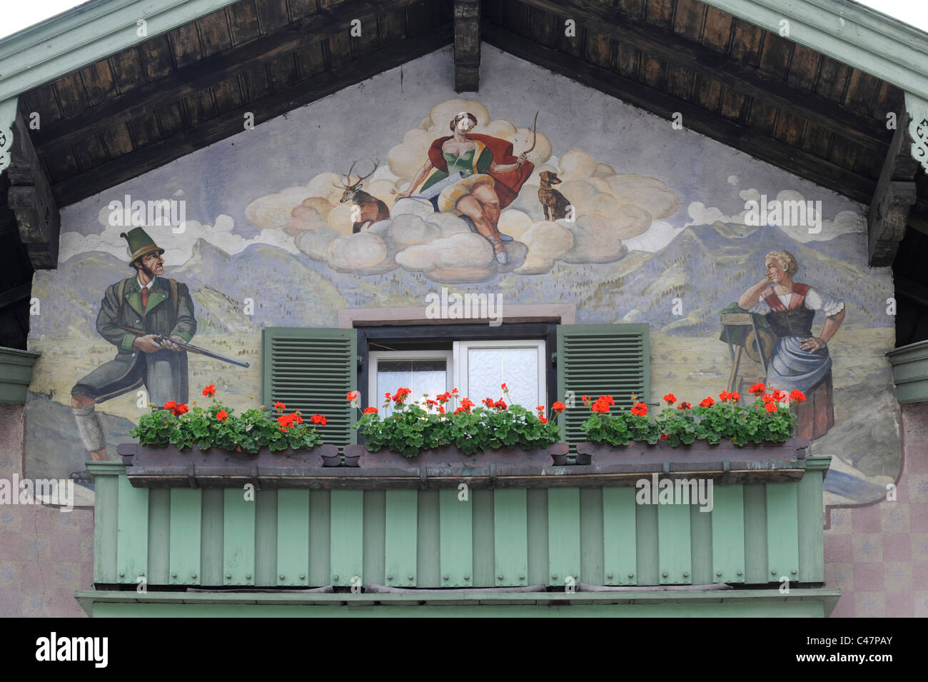 house facade and window decorated with traditional painting in Bavaria ...