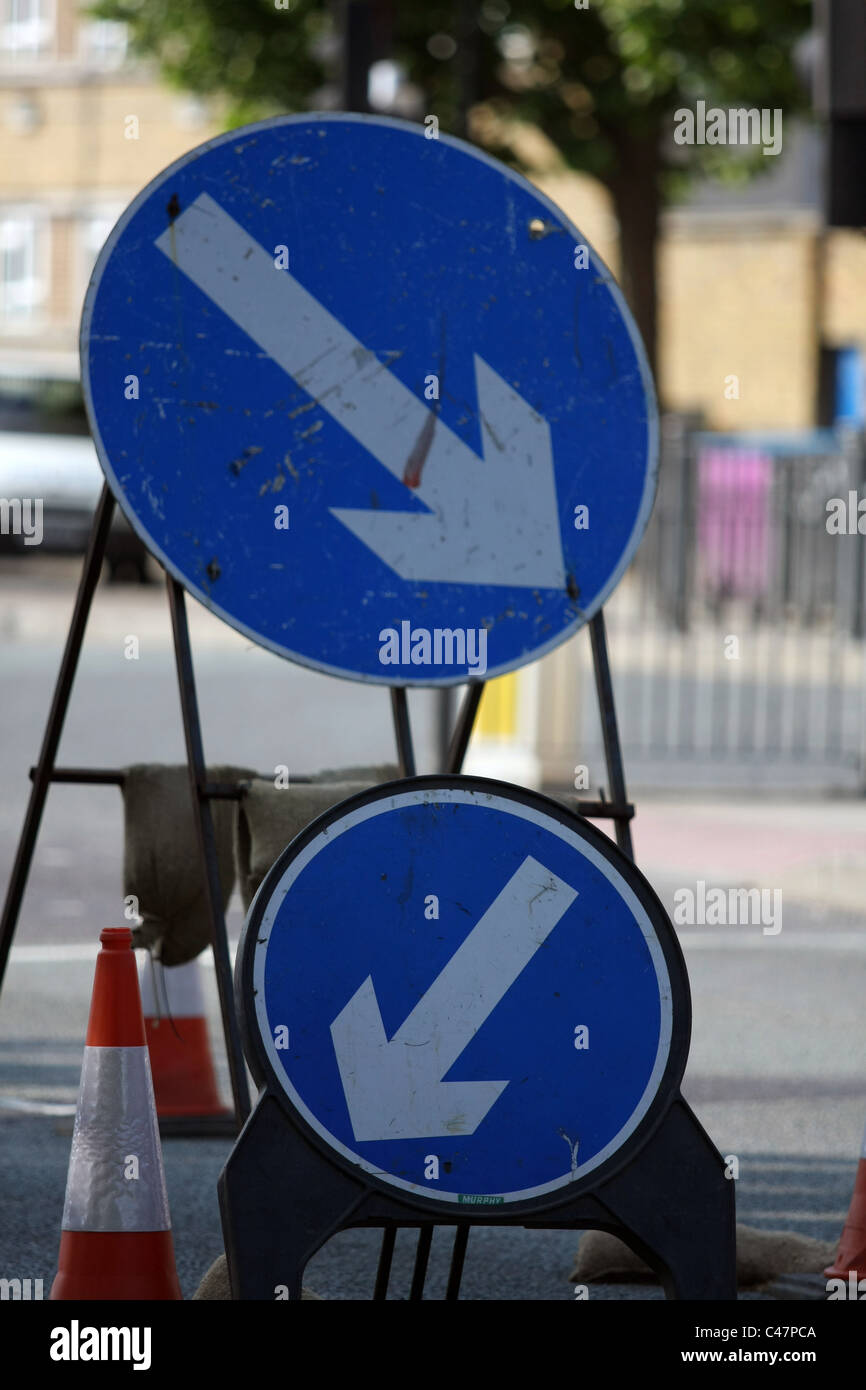 A keep right sign over a keep left sign near roadworks in london Stock ...