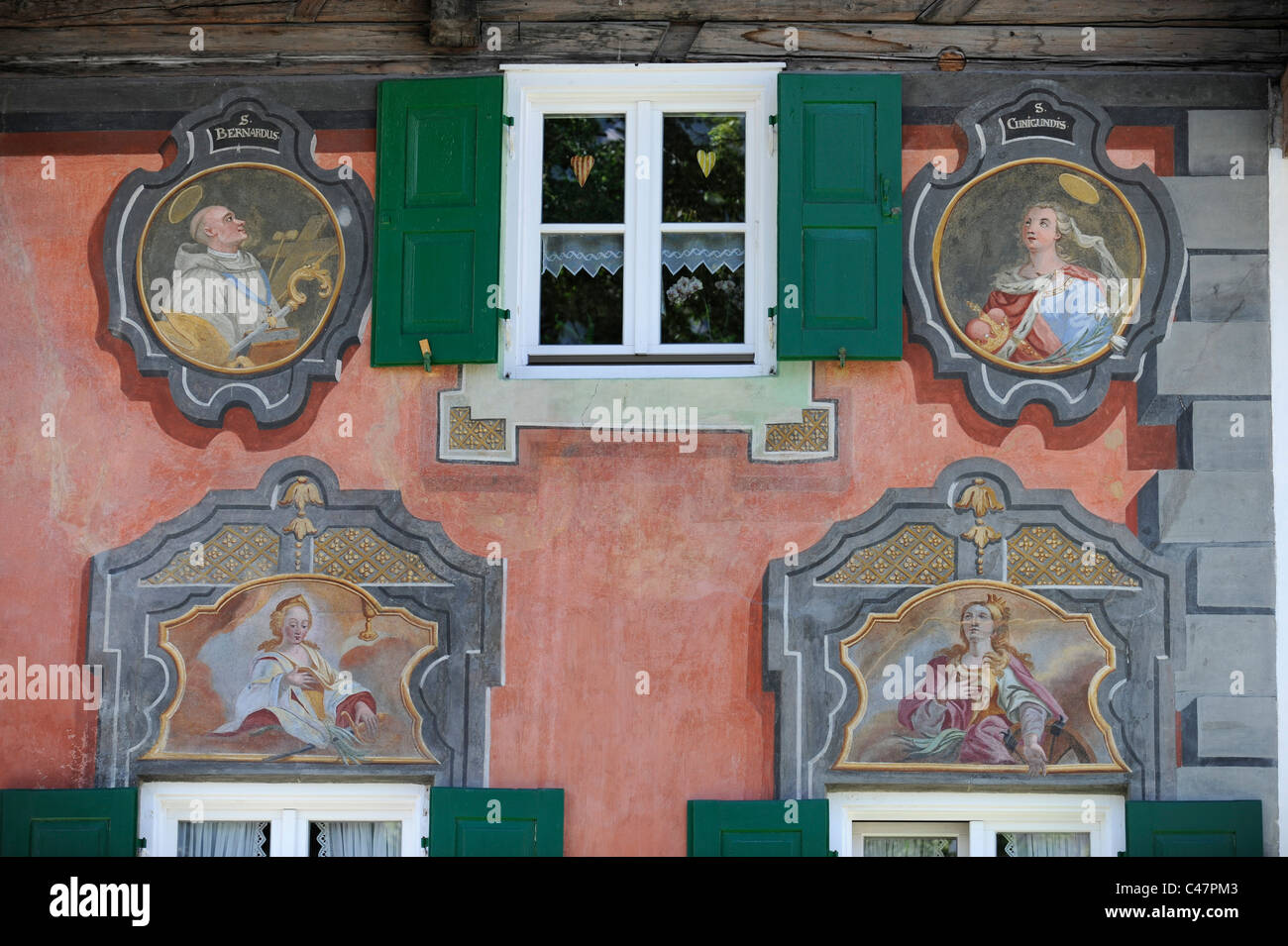 house facade and window decorated with traditional painting in Bavaria ...