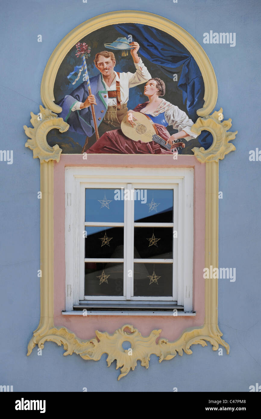 house facade and window decorated with traditional painting in Bavaria ...