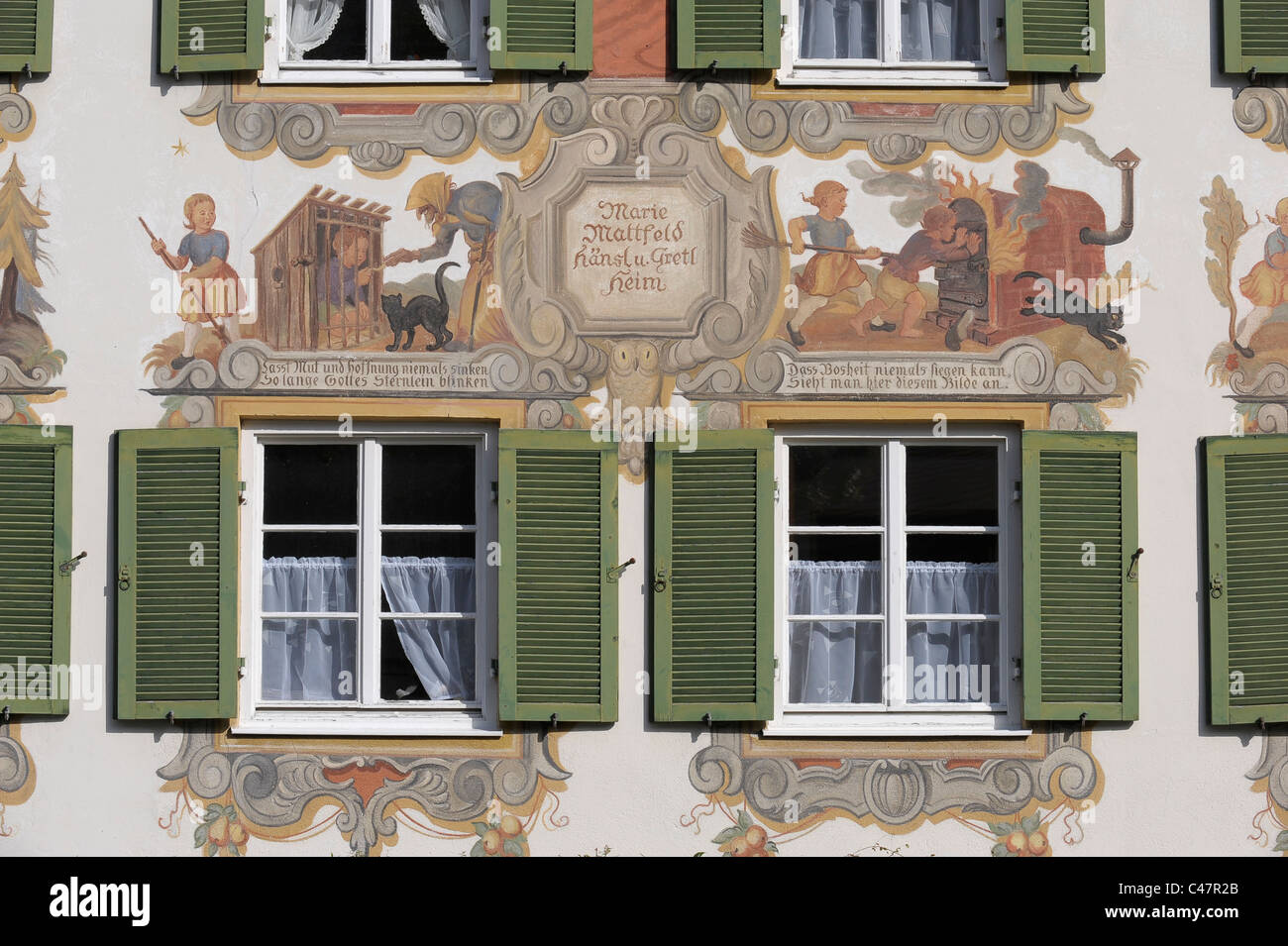 house facade and window decorated with traditional painting in Bavaria ...