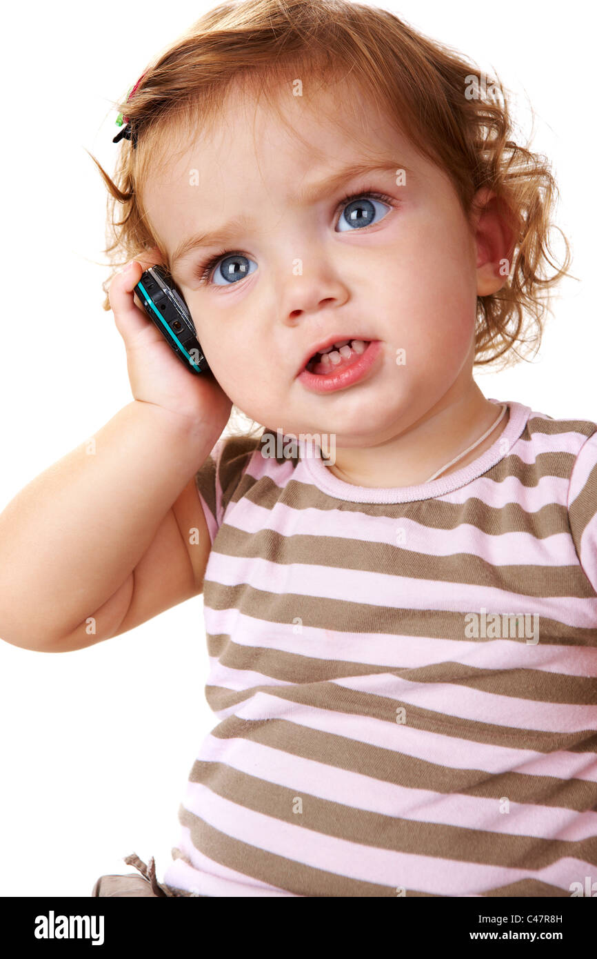 Portrait of cute toddler speaking by cellular phone Stock Photo - Alamy