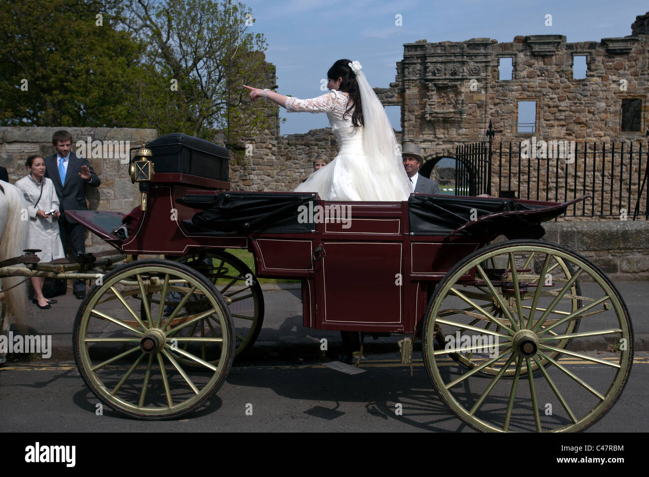 bride in wedding carriage in st andrews scotland Stock Photo - Alamy