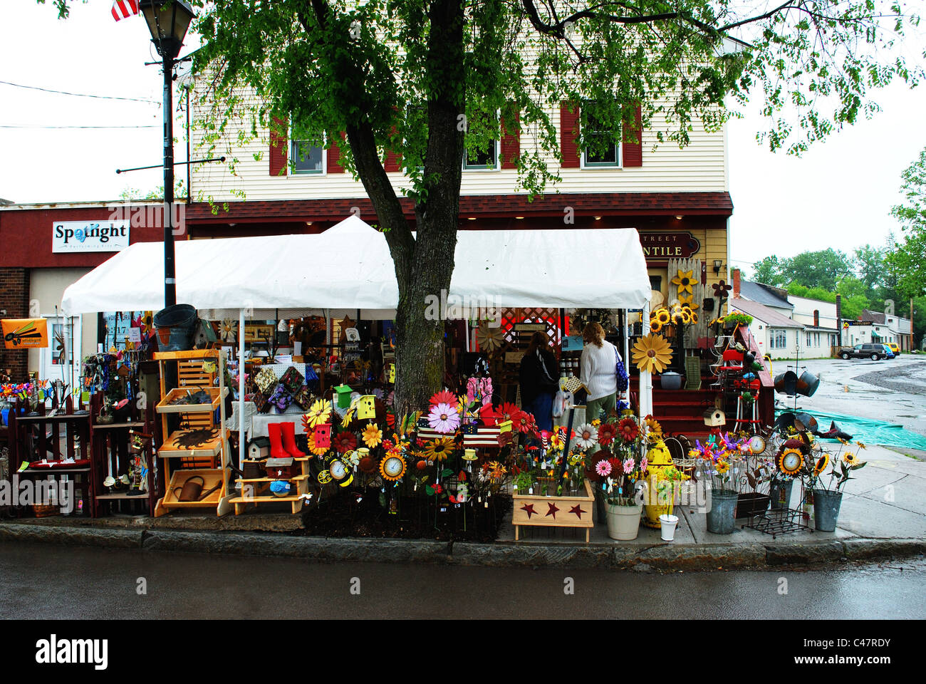 Merchant displays decorative merchandise outside on sidewalk for Canal ...