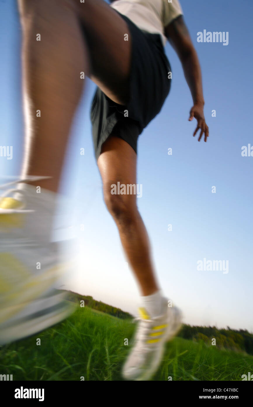 Person running across field hi-res stock photography and images - Alamy