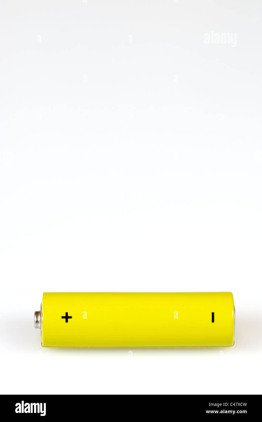 yellow small battery with positive and negative signs Stock Photo - Alamy