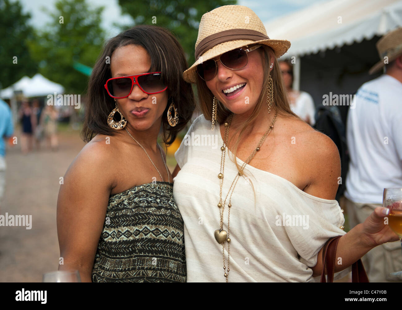 Two college age women having fun at a wine festival in Northern ...